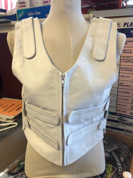 Female white leather bullet vest