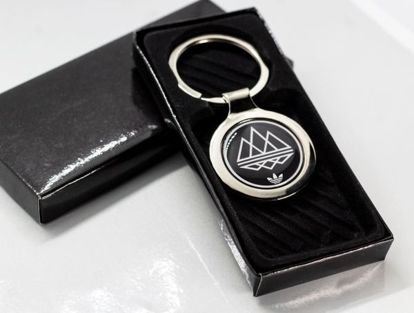 Adidas Spezial round keyring with chrome finish.