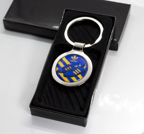 Adidas Stockholm keyring round keyring with chrome finish.