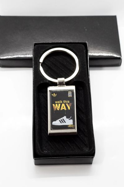 Adidas Walk This Way keyring with chrome finish.