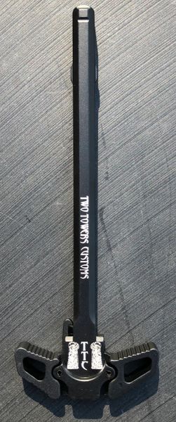 Charging handle with Two Towers Customs logo.