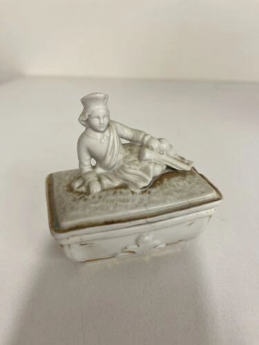 Antique Porcelain Laying Soldier Powder Box Figurine