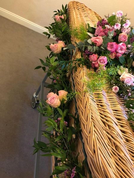 Garland of flowers to compliment a woven casket