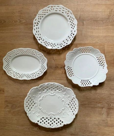 Set of 4 white porcelain plates with reticulated borders