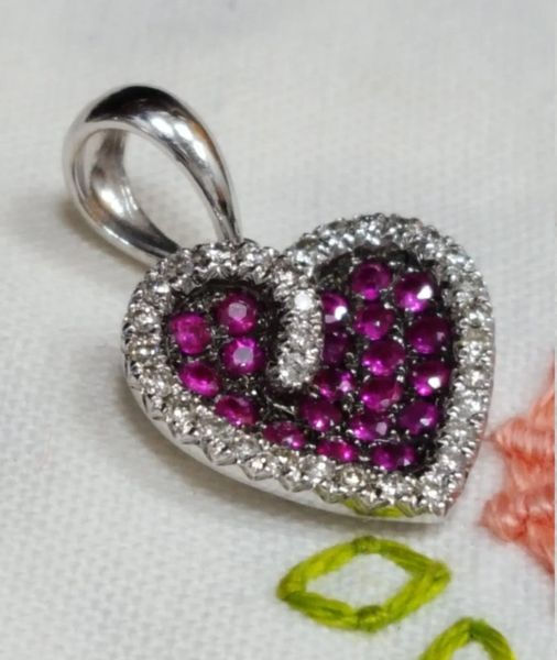 Ruby and Diamond heart pendant set in 14kt. white gold