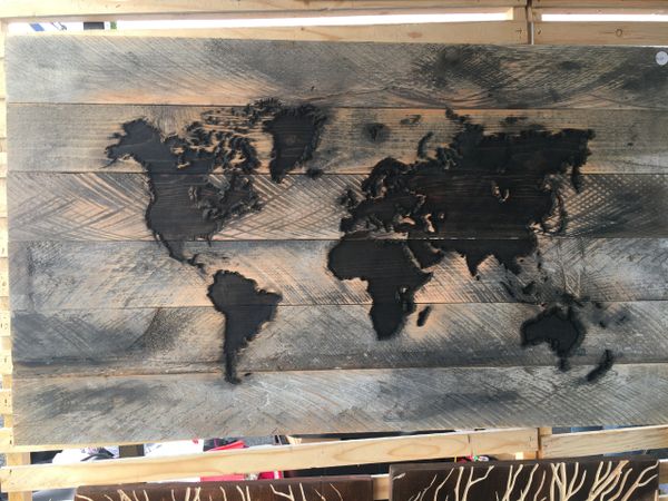 Rustic world map carved in wood