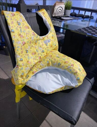 Yellow pacifier chair harness
